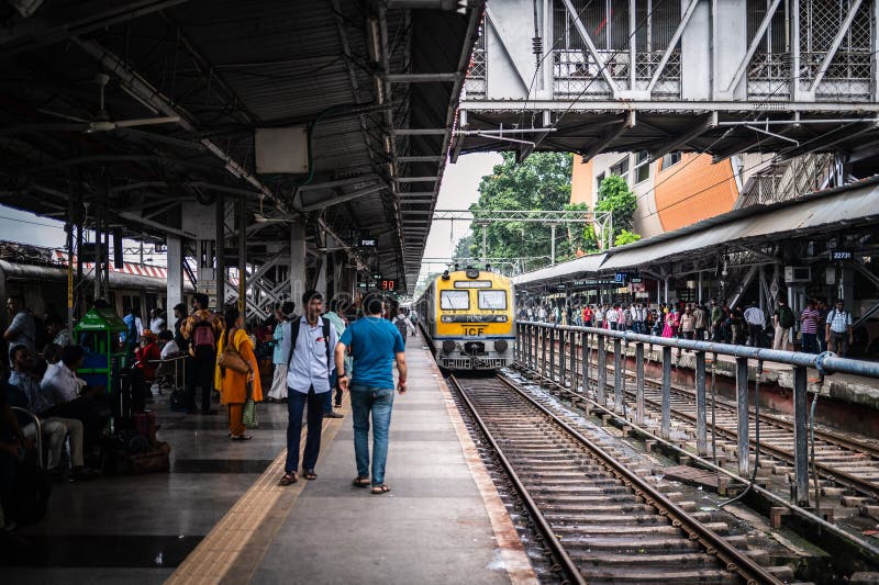 A Train is Coming To a Stop on the Platform of the Railway Junction ...