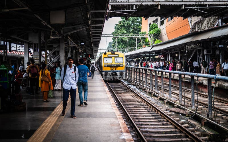 A Train is Coming To a Stop on the Platform of the Railway Junction ...