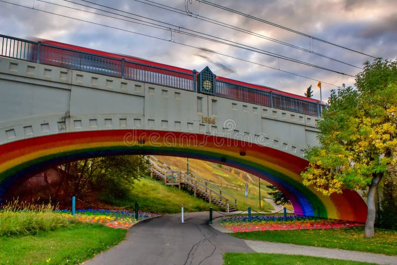 Train Crossing Over the Rainbow Bridge Stock Image - Image of trees ...