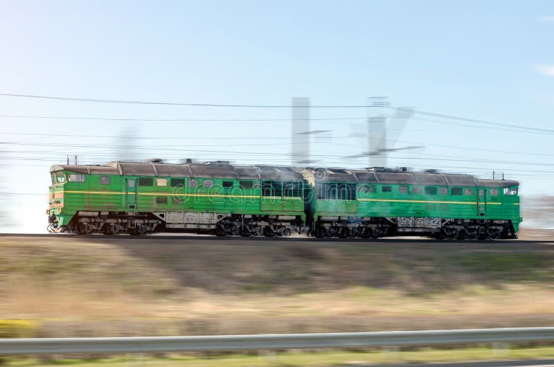 Train Double Locomotive, Green Rides at Speed by Rail. Stock Photo ...