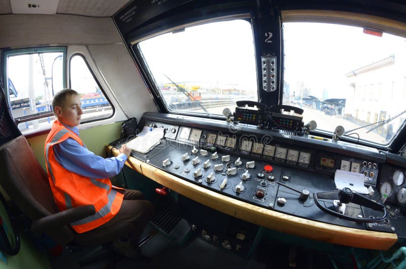 Train Driver Driving Passenger Train Sitting in the Cabin in Front of ...