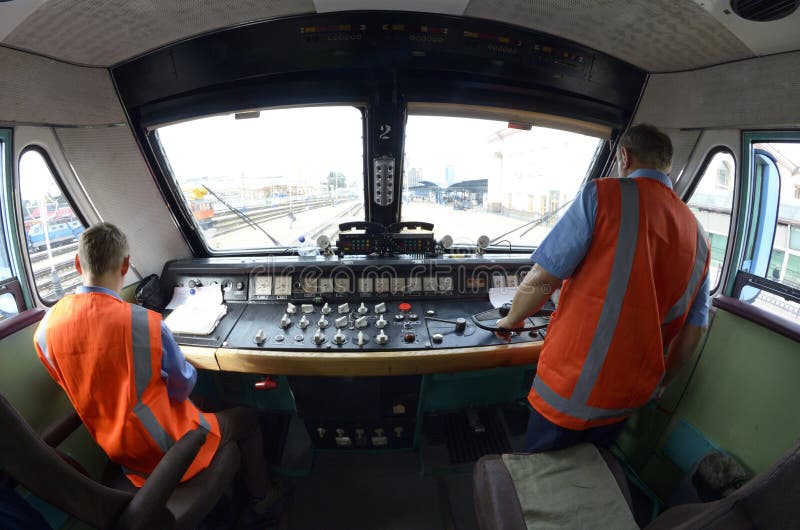 Train Drivers Driving Passenger Train Sitting in the Cabin in Front of ...