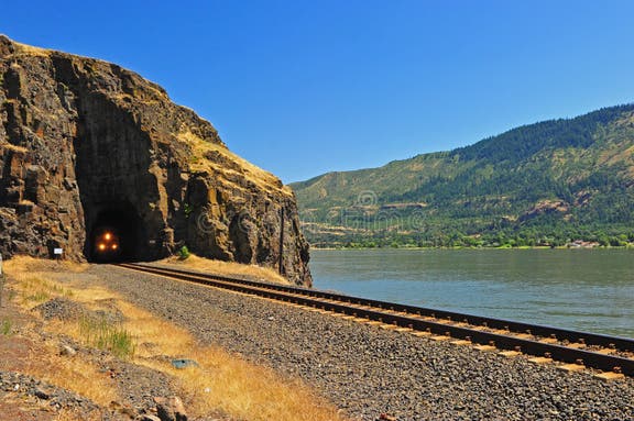 Train emerging from tunnel stock photo. Image of rail - 20166524