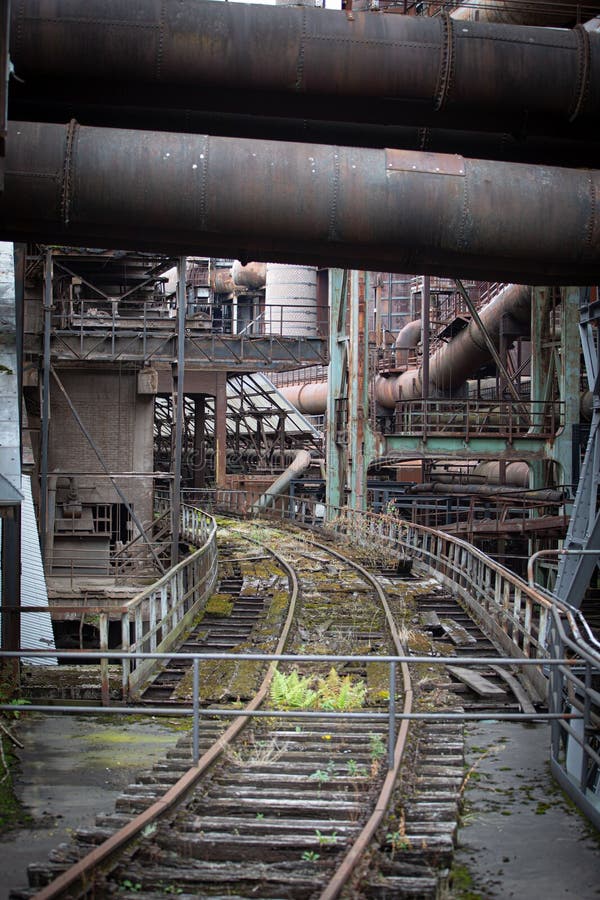 A Train Engine Tracks Passing through an Old Industrial Plant Area ...