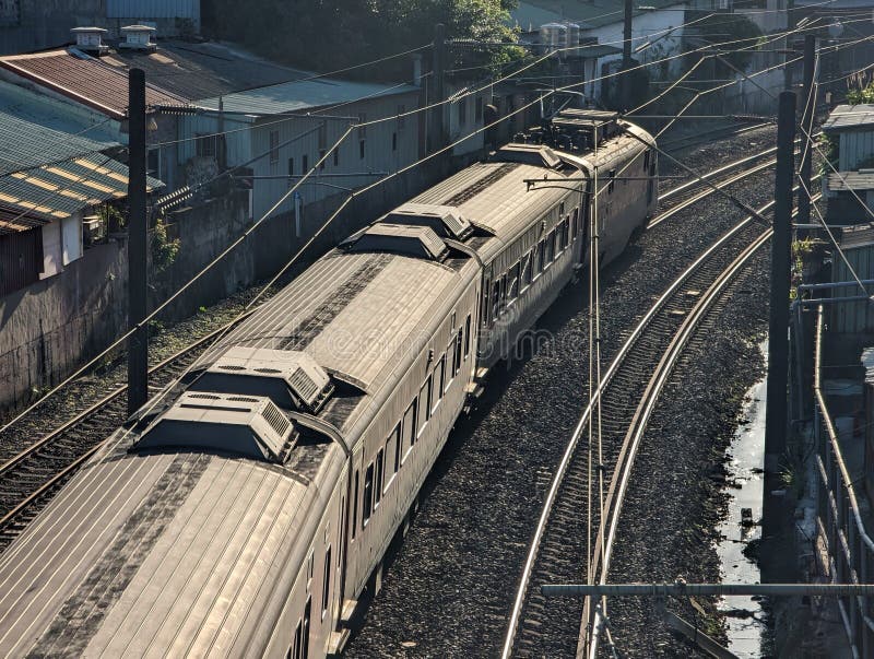 Train Going Around a Curve Under the Shadow of the Sunset Stock Photo ...