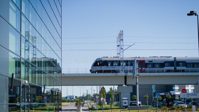 Train Going on Elevated Tracks in Front of a Glass Building in Gdansk ...