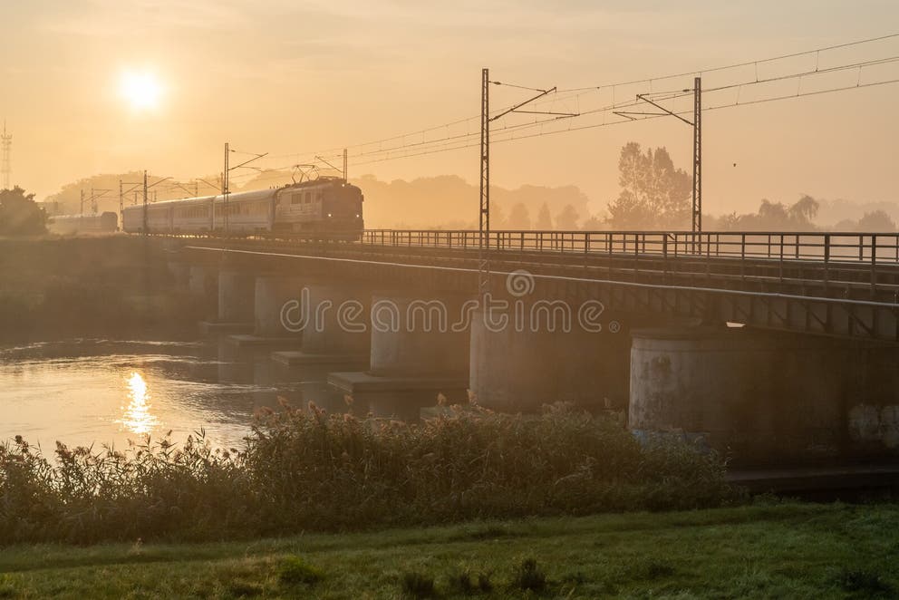 Train Going Over a Bridge at Sunrise Stock Image - Image of journey ...