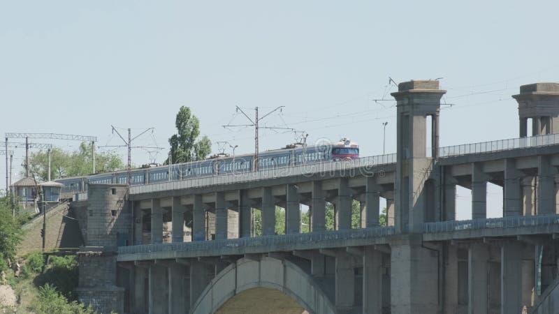 A Train is Going Over a Bridge Stock Video - Video of passes, passenger ...