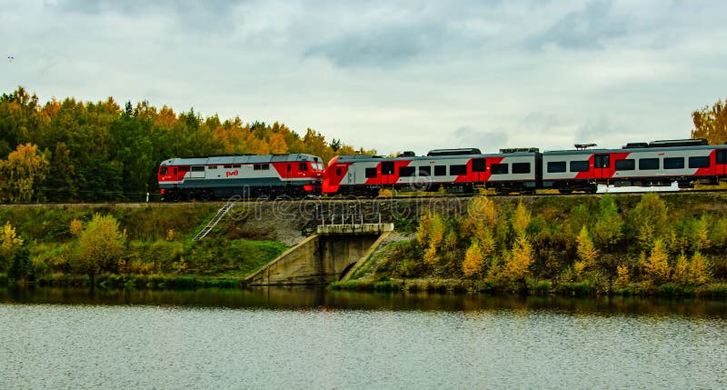 Passenger Train Running Over the Dam Along the River Stock Image ...