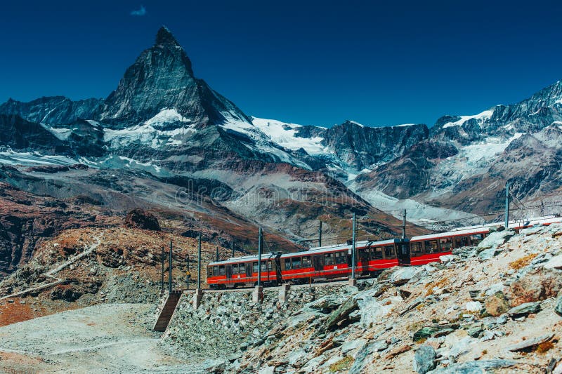 Train in High Alps Mountains on Matterhorn Background Stock Photo ...