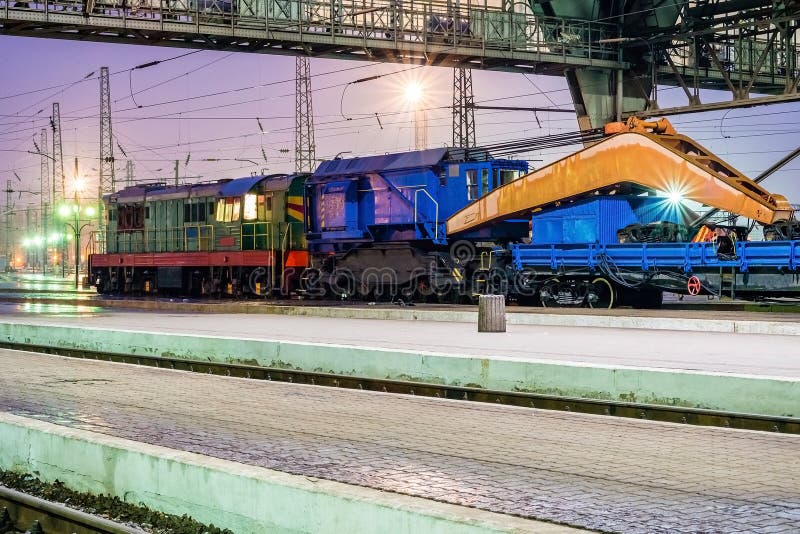 Train with Industrial Equipment at the Railway Station at Night. Stock ...