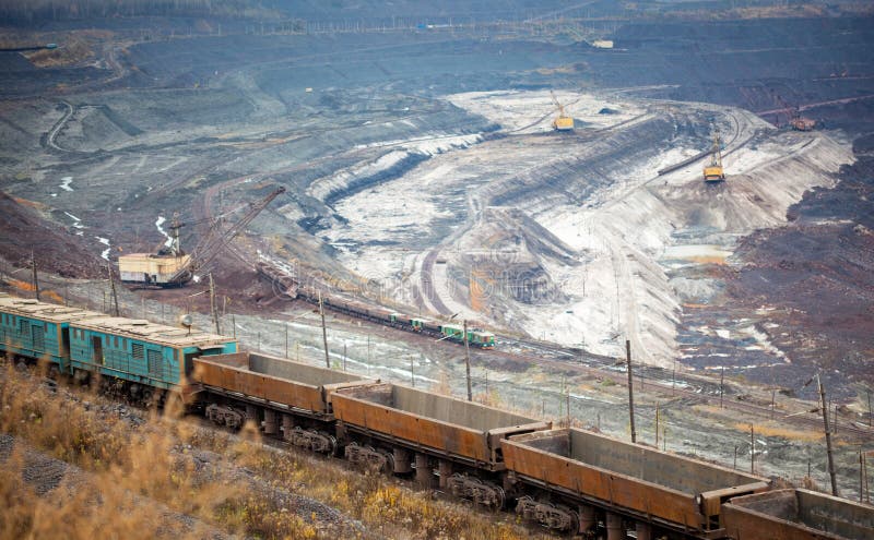 Train at the Iron Ore Opencast Mine is Going for Loading Iron Stock ...