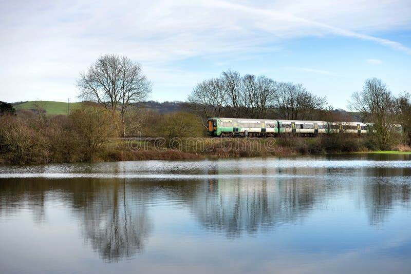 Train and lake stock image. Image of commuting, water - 71303955