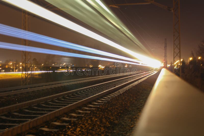Train with Light on Long Exposure in Station at Night Scene. Stock ...