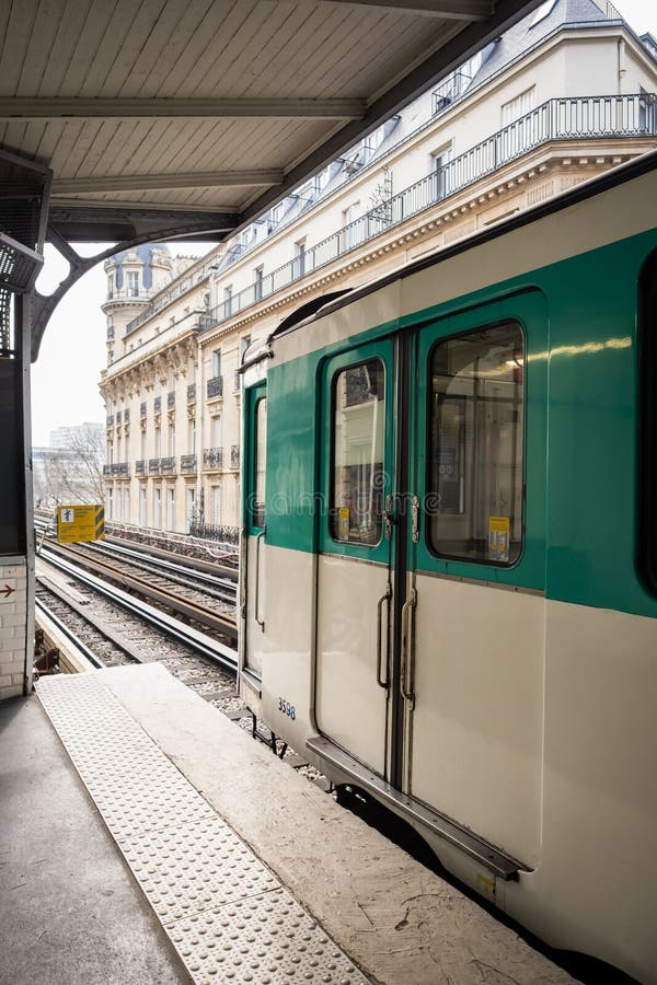 A Train on Line 6 of the Parisian Elevated Metro Stops on a Station ...