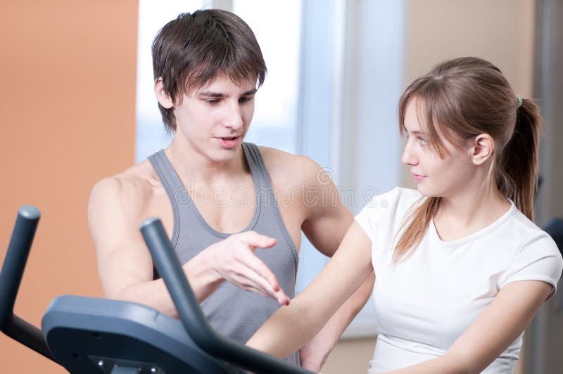Train on Machine in a Gym with Instructor Stock Photo - Image of ...
