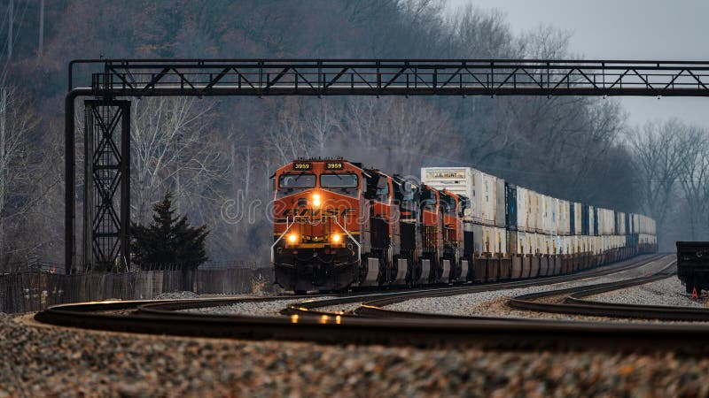 Train Moving Down Tracks at Dusk during the Day Time, Editorial Stock ...