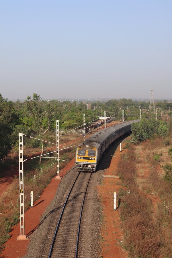 The Train Moving on a Railway Line with Blue Sky in the Background ...