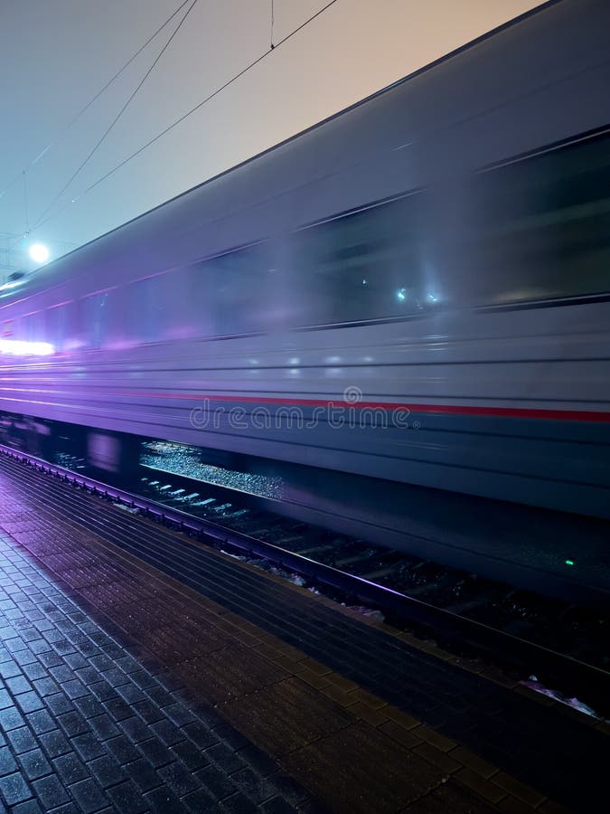A Train is Moving on a Track with Purple Lights Stock Photo - Image of ...