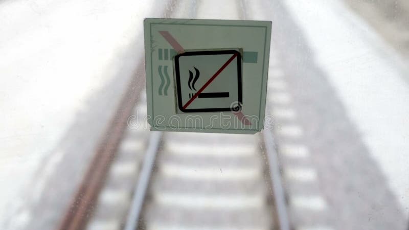 No Smoking Sign Symbol on Glass in White Print with Lines Next To it ...