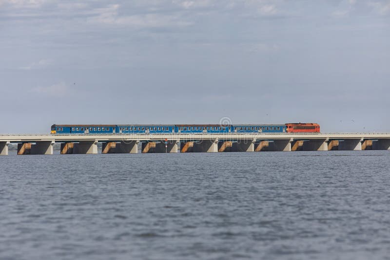 Train over a lake stock photo. Image of diesel, pass - 101411326