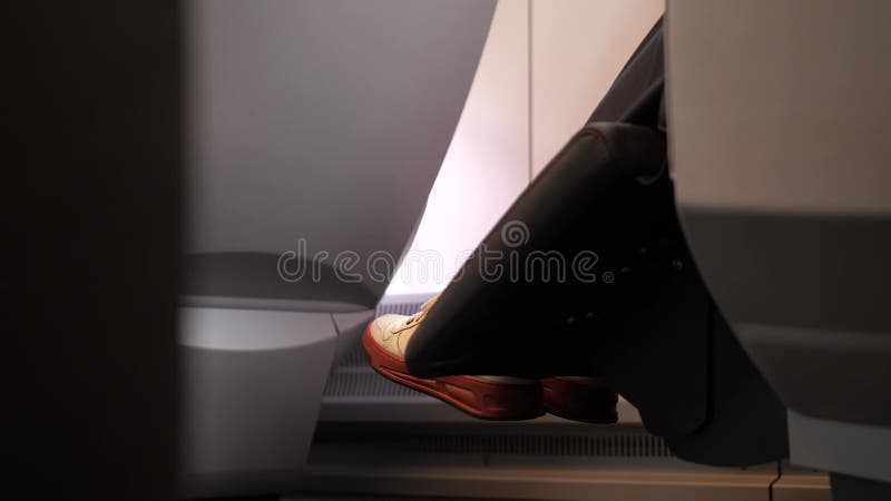 A Train Passenger in a Comfortable Carriage Folds the Seat into a Lying ...