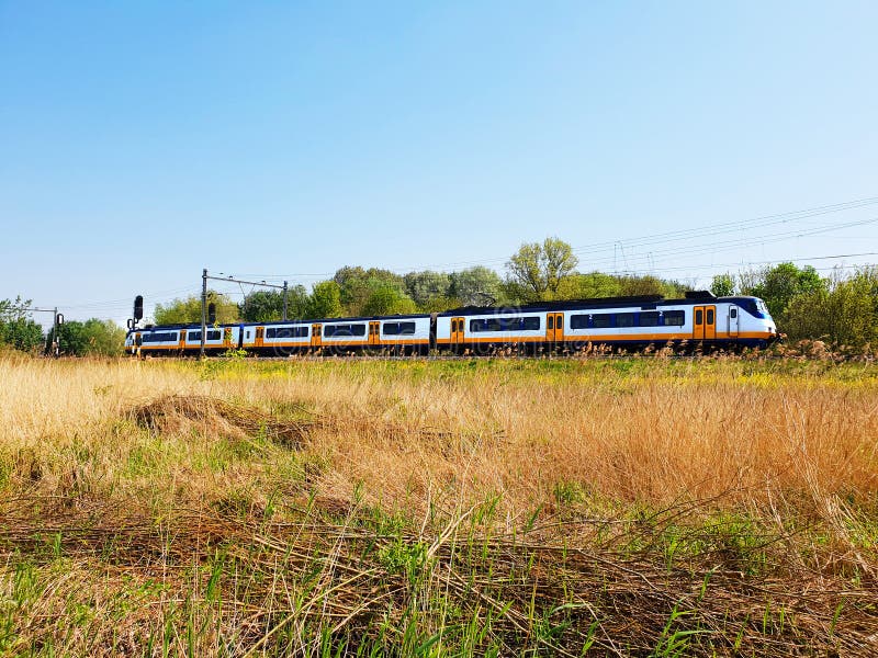 Train Passing in a Open Field Stock Photo - Image of metal, fast: 145581296