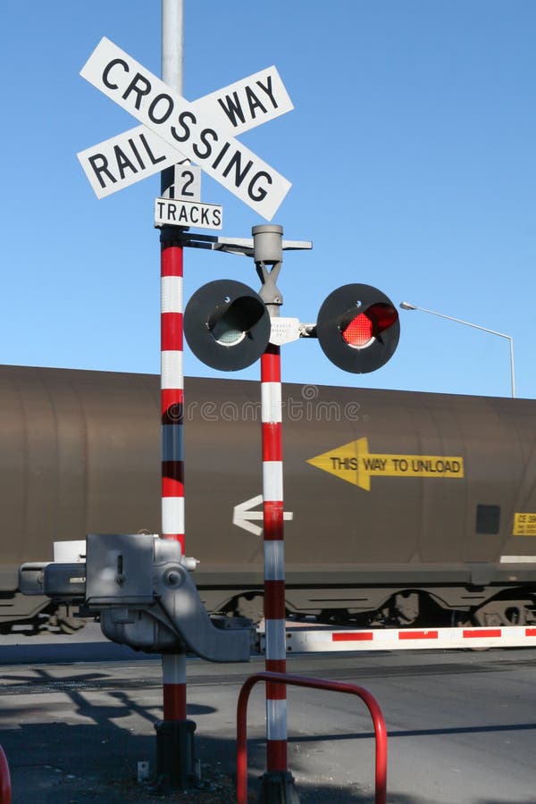 Train Passing a Railway Crossing. Black Wagon. Red Light Editorial ...