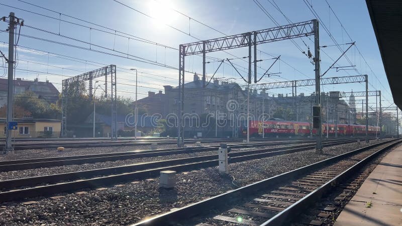 Poland, Krakow, Train Pulling into Train Station Next To Loading ...