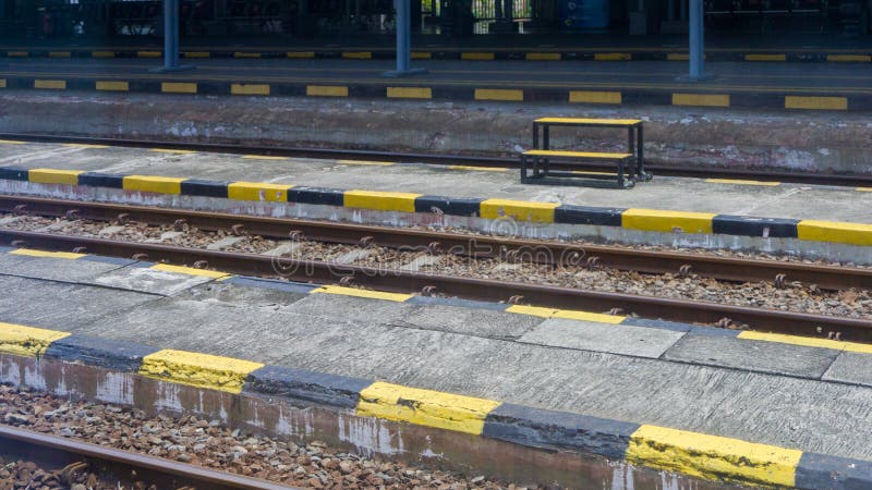 Train Rails with a Ladder Step To Help Passenger Get into Train. High ...