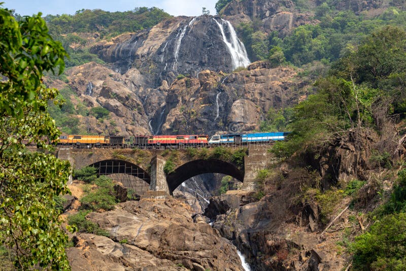 Train on the Railway Bridge on the Background of the Dudhsagar Falls ...