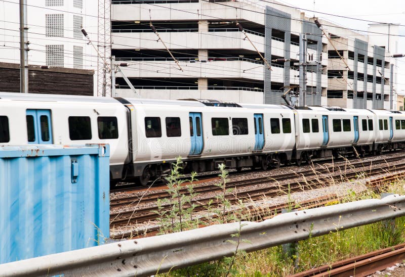 Train on a Railway Line through a City Background Stock Image - Image ...