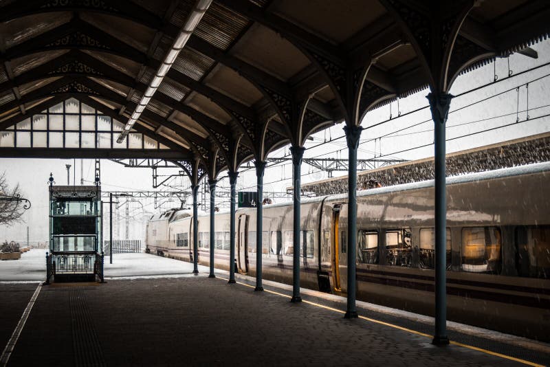 Train in a Railway Station Covered with Snow in Winter Stock Photo ...