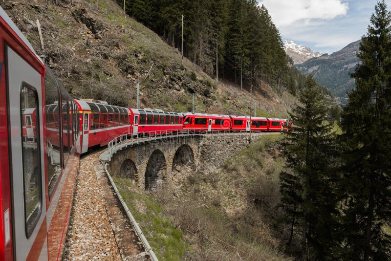 Train Ride in the Swiss Alps, with Company. Stock Image - Image of blue ...