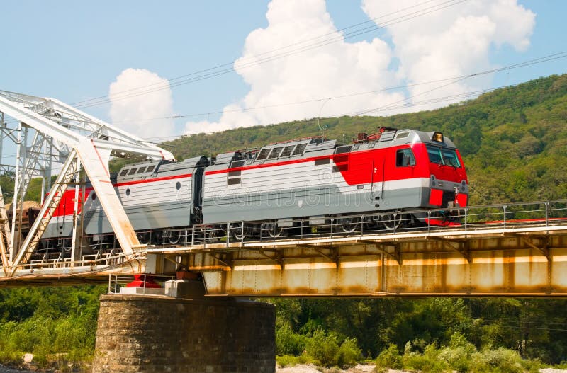 Train rides over bridge stock image. Image of region - 32941983