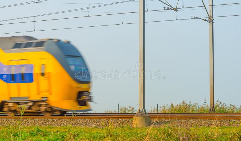 Train Riding through Nature in Sunlight at Fall Stock Photo - Image of ...