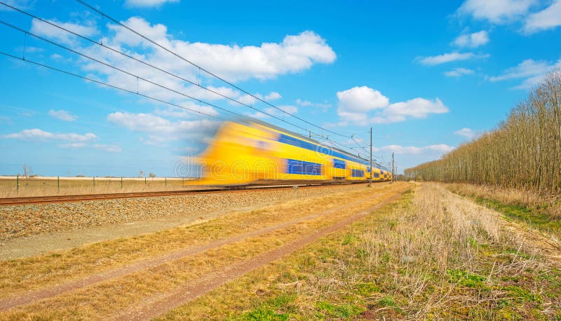 Train Riding through Nature in Sunlight Stock Photo - Image of sunny ...