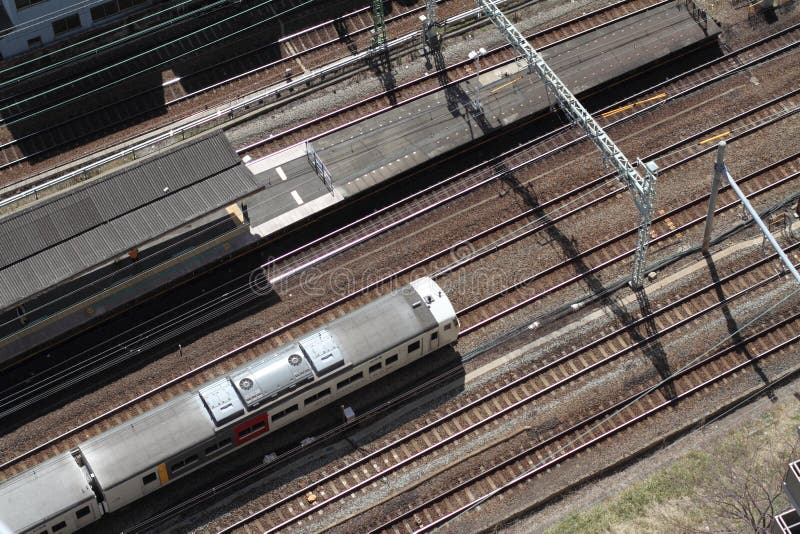 Train Running through Station Stock Image - Image of running, railroad ...