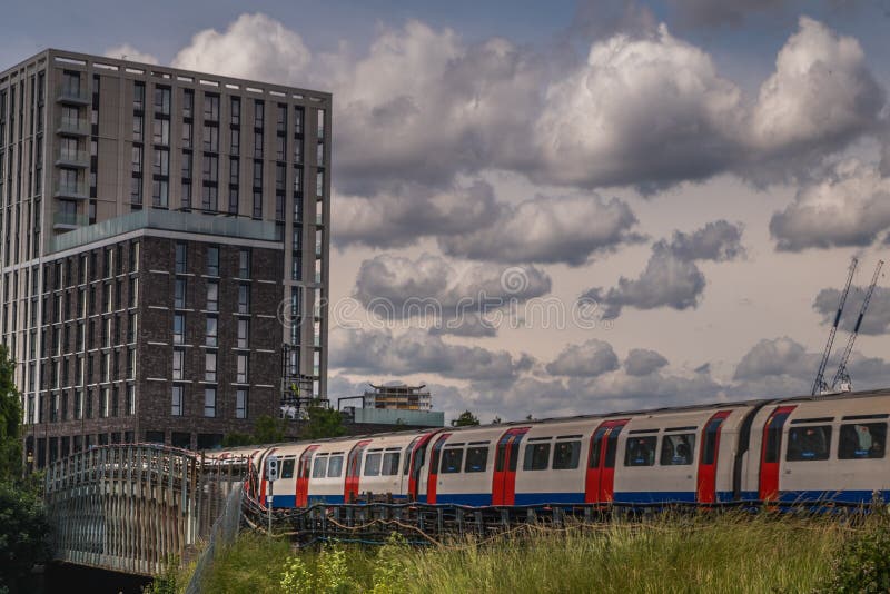 Train Running on the Train Track with the Backdrop of the Building and ...