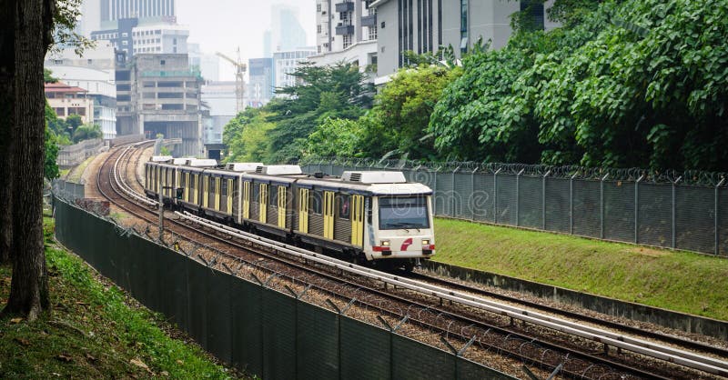 The Train Running on Track in Kuala Lumpur, Malaysia Editorial Photo ...