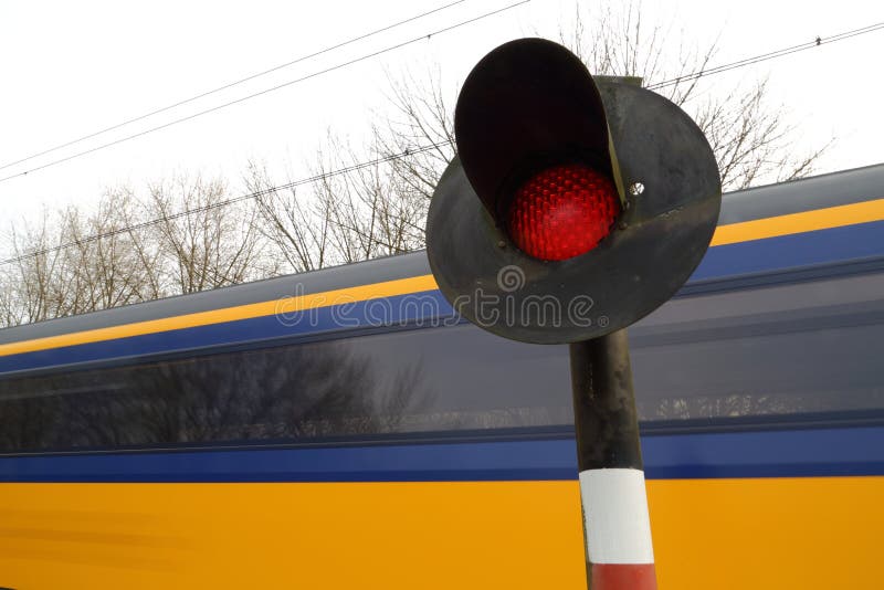 Train Rushing Past Railway Crossing Stock Image - Image of blue, high ...