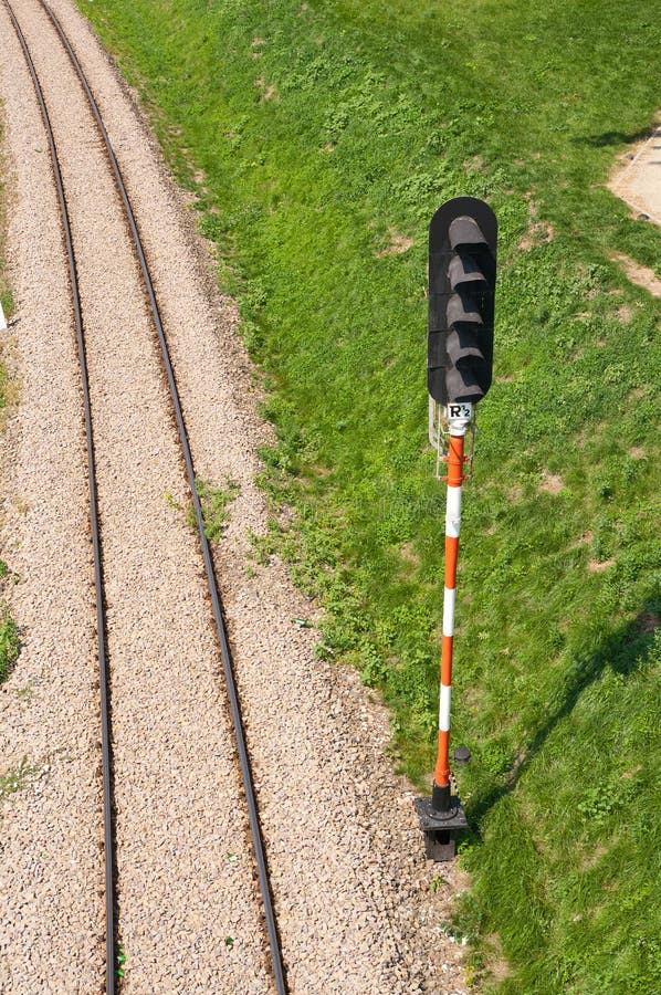 Train Semaphore Light with Six Lamps at a High Gray Concrete Pillar ...