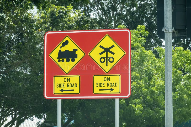 Train on Side Road Warning Sign Stock Image - Image of arrows ...