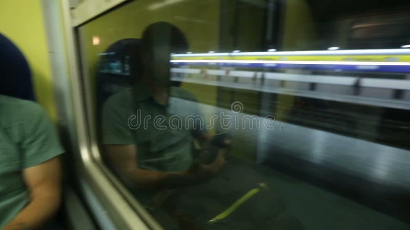 Train Slowly Stopping at Empty Station Platform, Guy with Gadget by ...