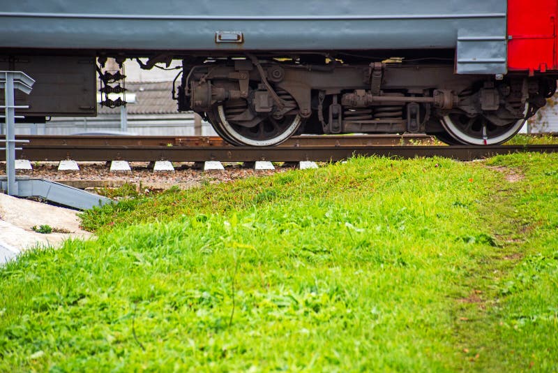 The Train Stands on the Rails Along the Footpath in the Grass Stock ...