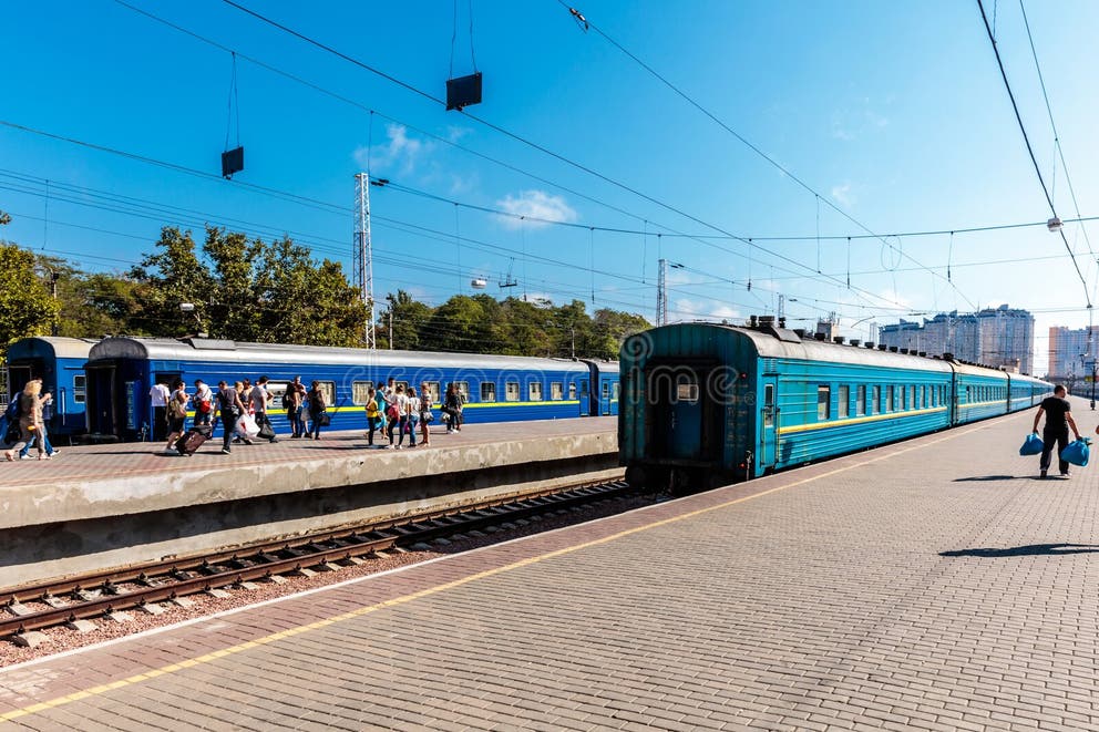 A Train Station with a Blue Train Pulling into the Station Editorial Stock Photo - Image of ...