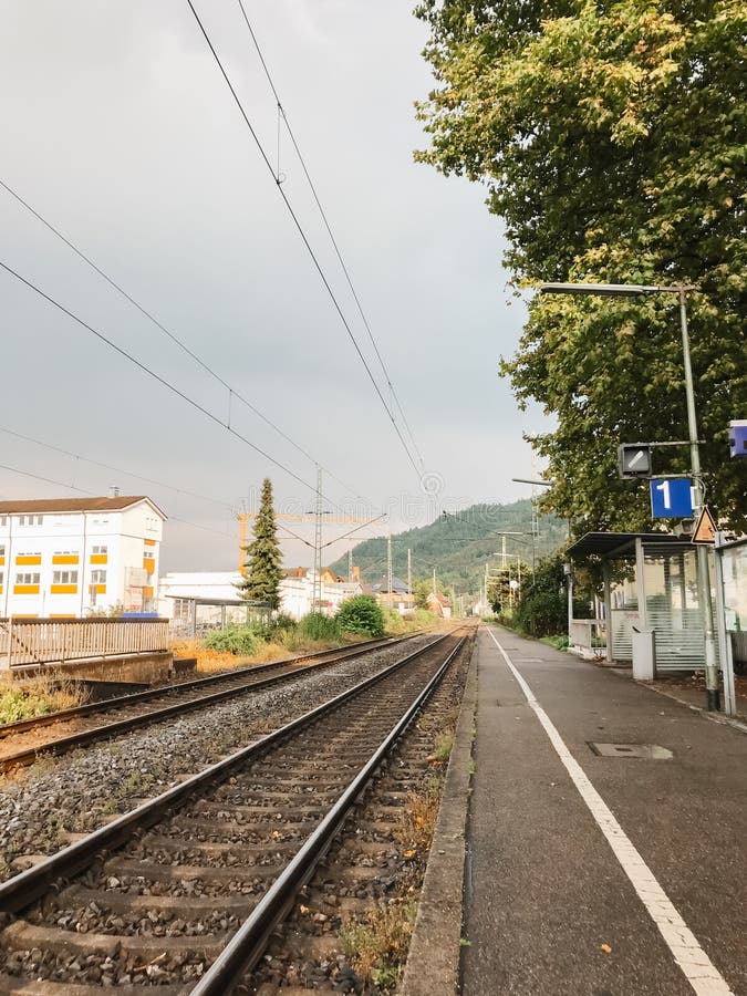 A Train Station with a Blue Sign that Says 1 Stock Image - Image of ...