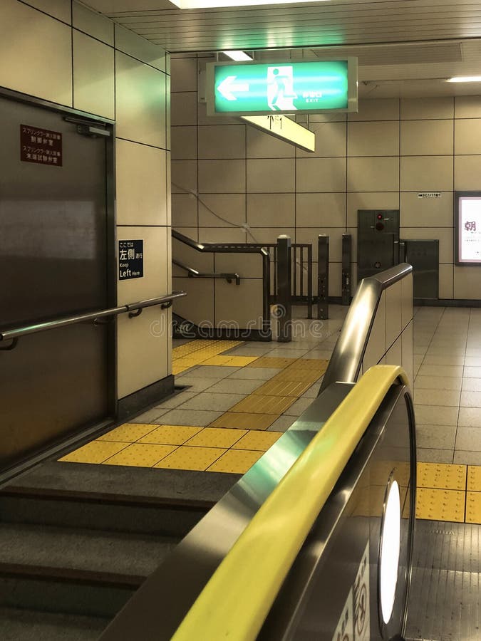 Train Station Escalator and Exit Sign Inside Tokyo Metro Stock Photo ...