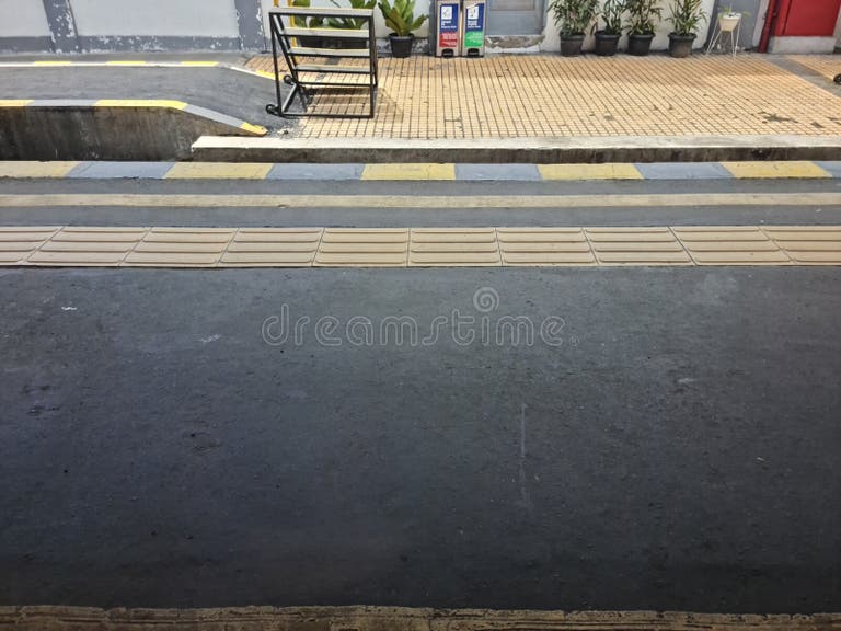 Tactile Paving and Accessibility Ramp at Train Station Stock Image ...