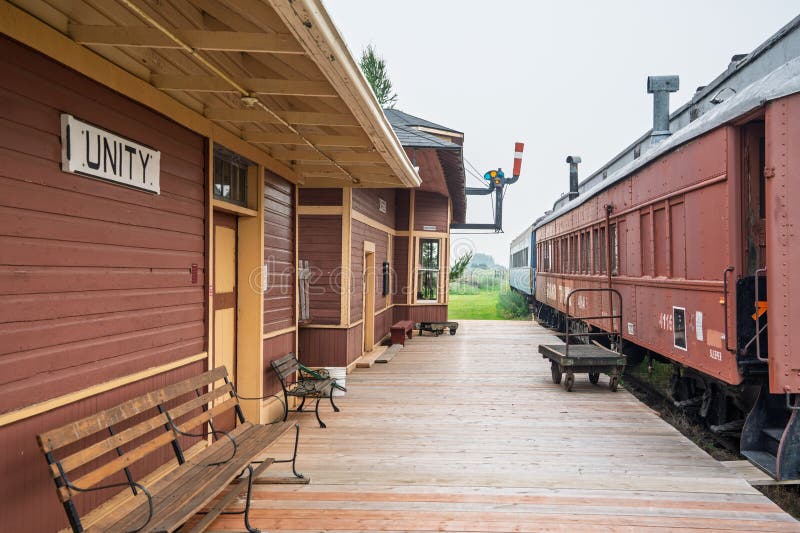 Train Station with a Red Building and a Sign that Says Unity Stock ...